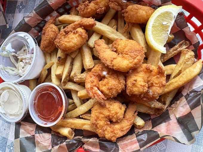 Fried shrimp and fries piled high enough to make your inner child do a happy dance of joy.