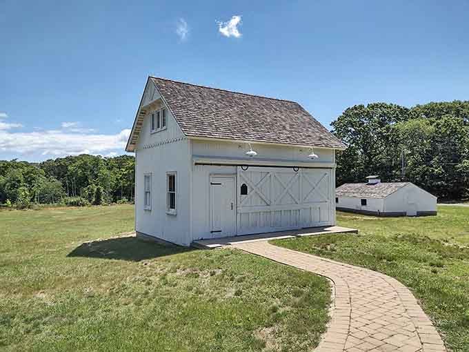 The charming white barn provides a traditional contrast to its decidedly non-traditional neighbor, the giant concrete duck.