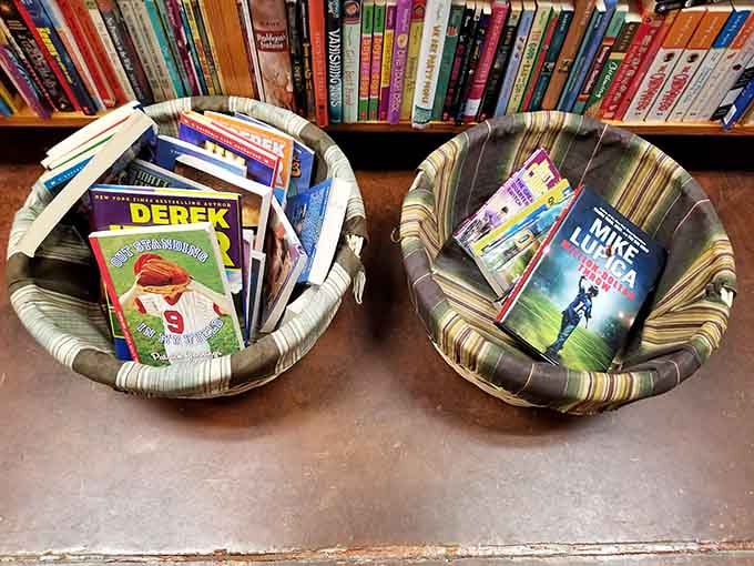 Wicker baskets cradling paperbacks like precious eggs, each one holding adventures waiting to hatch for young readers.