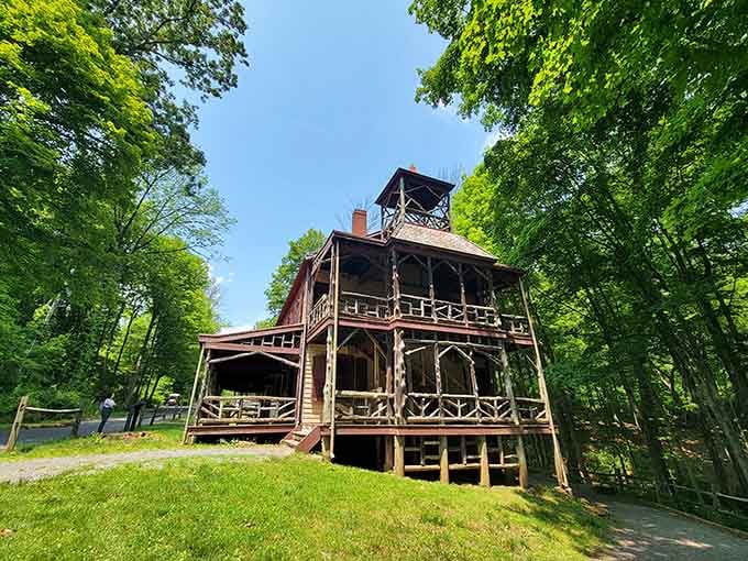 The General Store and Church building towers over the village like a wooden guardian watching the forest.