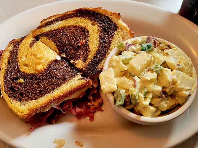 That Reuben sandwich with potato salad proves lunch here rivals breakfast for pure satisfaction.