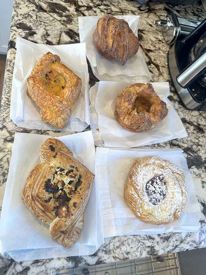 Fresh pastries lined up like edible works of art, each one begging to accompany your morning coffee ritual.