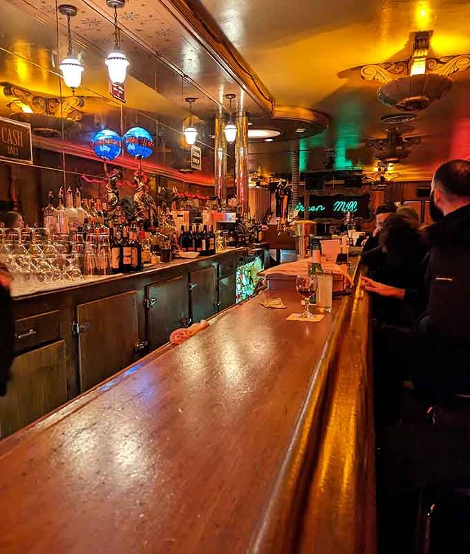 The curved bar where bartenders have been mixing perfect cocktails since your grandparents were dancing to swing.