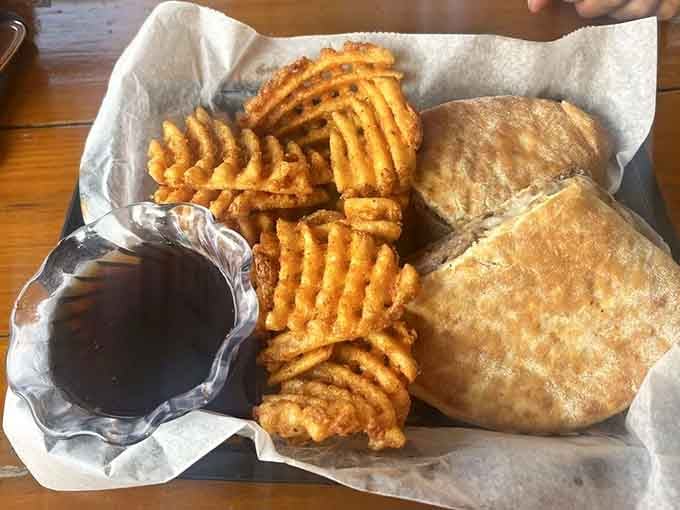 Waffle fries and a hearty sandwich stacked high deliver comfort food that actually comforts, not just fills you up temporarily.