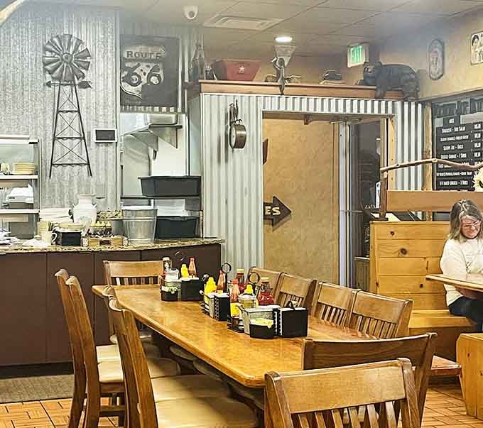 More rustic decor with windmill art and galvanized metal, creating that authentic country vibe you can't fake no matter how hard you try.