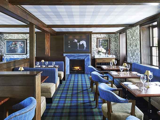 Private dining with a fireplace and plaid accents &ndash; it's like someone designed the coziest Scottish lodge in Maryland.