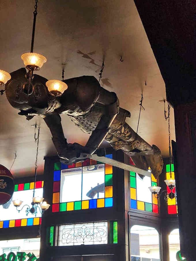 Look up and you'll find treasures everywhere, including this mysterious figure keeping watch over the dining room below.