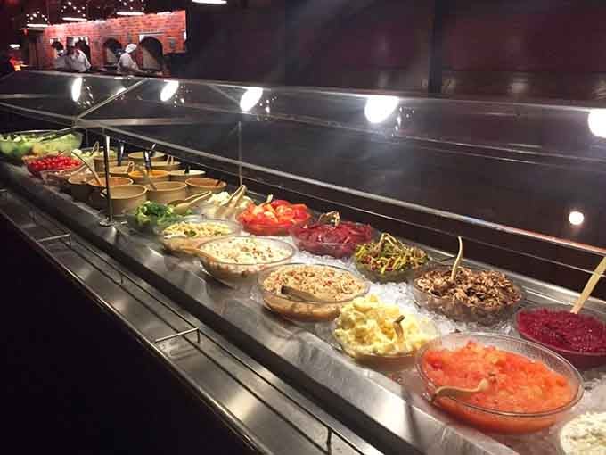 The salad bar offers fresh options for those who insist on pretending they're eating healthy tonight.