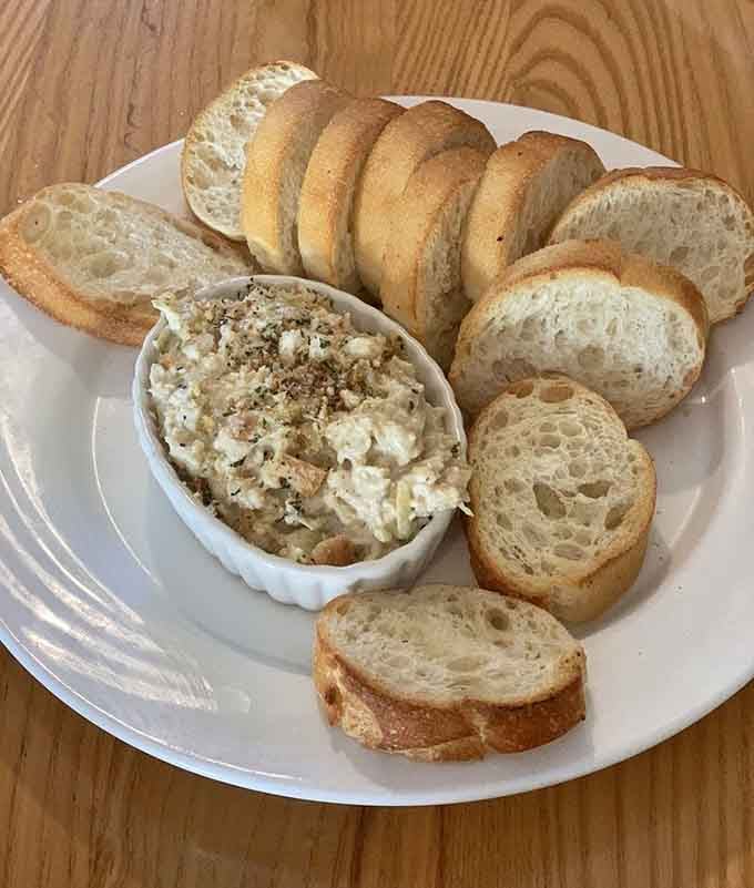 Baked Artichoke Dip with crusty bread makes sharing with friends an absolute culinary necessity.