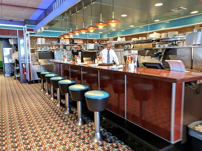 Counter seating with a view of the kitchen action, dinner and a show without the ticket price.