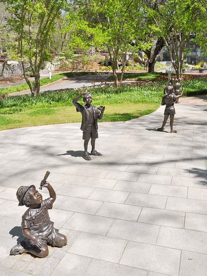 Bronze children frozen mid-play remind us that gardens are meant for joy, wonder, and maybe a little mischief.