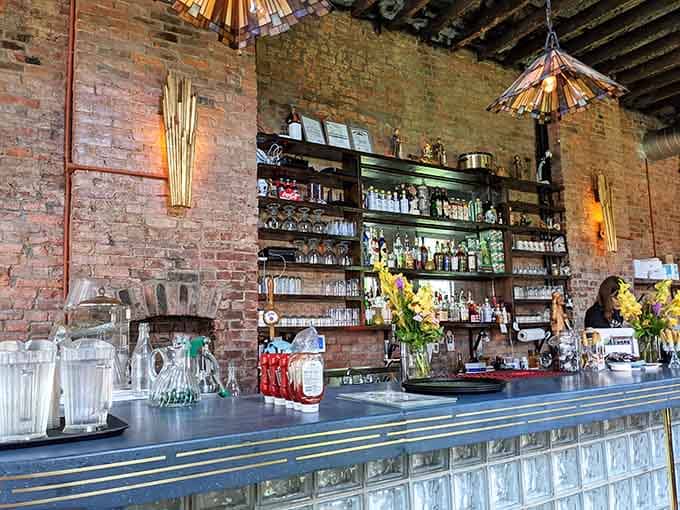 That vintage-style bar with its blue-striped front and shelves of possibilities, where good drinks meet good conversation naturally.