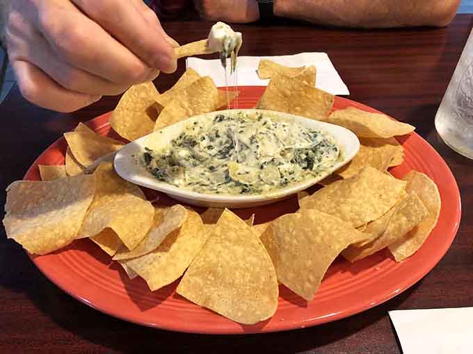 Hot spinach dip surrounded by crispy chips is the kind of starter that disappears before the entrees arrive.