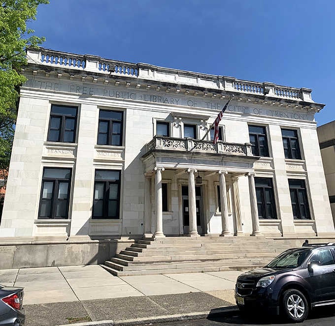 The Free Public Library's classical facade stands as a temple to knowledge that doesn't charge membership dues.