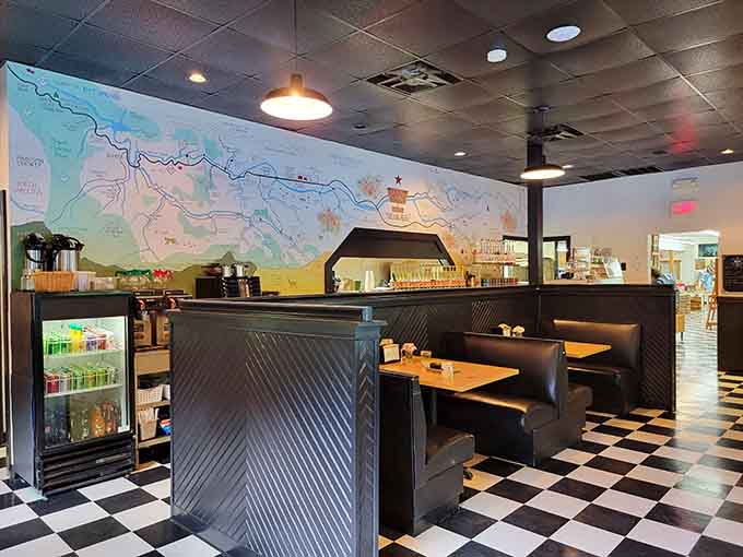 A cozy dining area with booth seating and that signature checkered floor invites you to rest your shopping-weary feet.