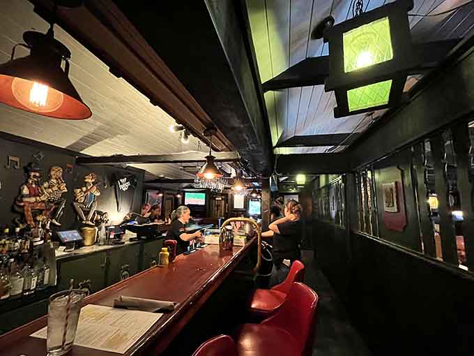 The bar area glows with character, where locals gather and newcomers quickly feel like regulars themselves.