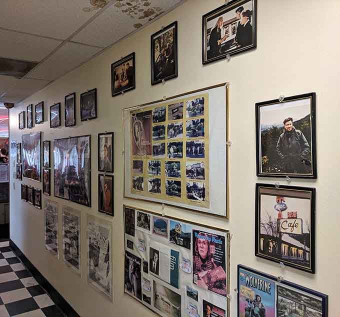 Walls decorated with framed photographs tell stories of the cafe's cultural significance and television history without being overwhelming.