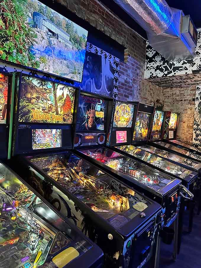 Jurassic Park pinball machines lined up like dinosaurs at a watering hole, ready to devour your quarters and your free time.