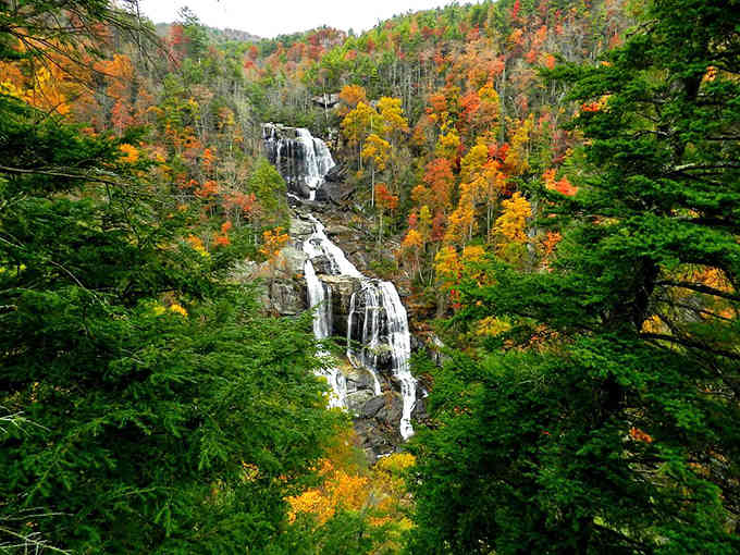 Fall transforms the gorge into a painter's palette, with the white water contrasting brilliantly against autumn's fiery colors.