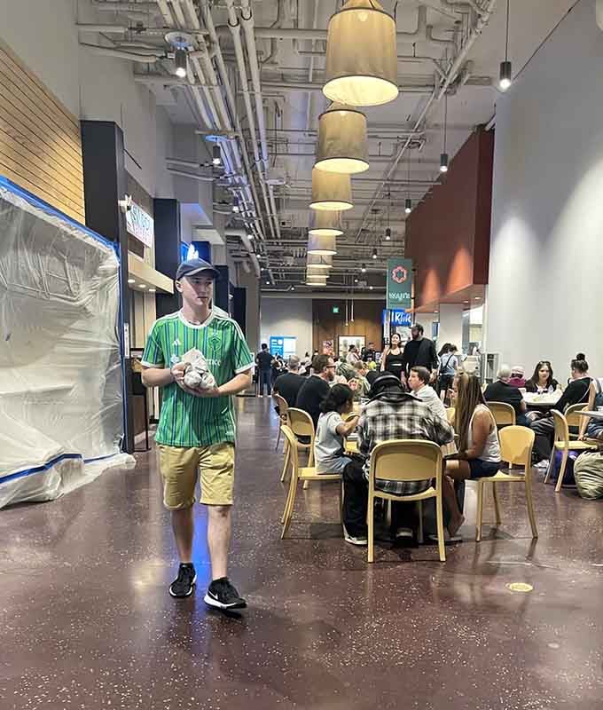 Happy diners enjoying their finds in a space that feels more like a community gathering than a mall.