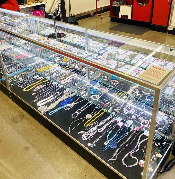 Sparkling jewelry behind glass proves that treasure hunting can yield genuinely glamorous results here.