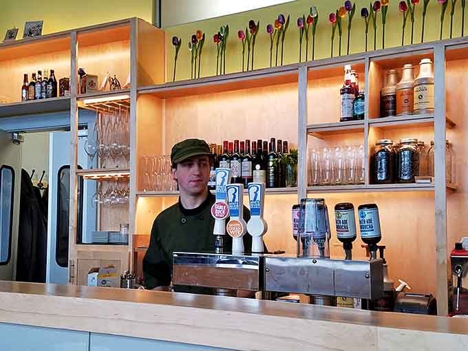 The bar area lined with Dutch beers and tulips, because some stereotypes exist for delicious reasons.