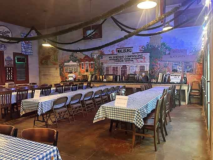 Long communal tables with checkered cloths invite strangers to become friends over shared plates and stories.