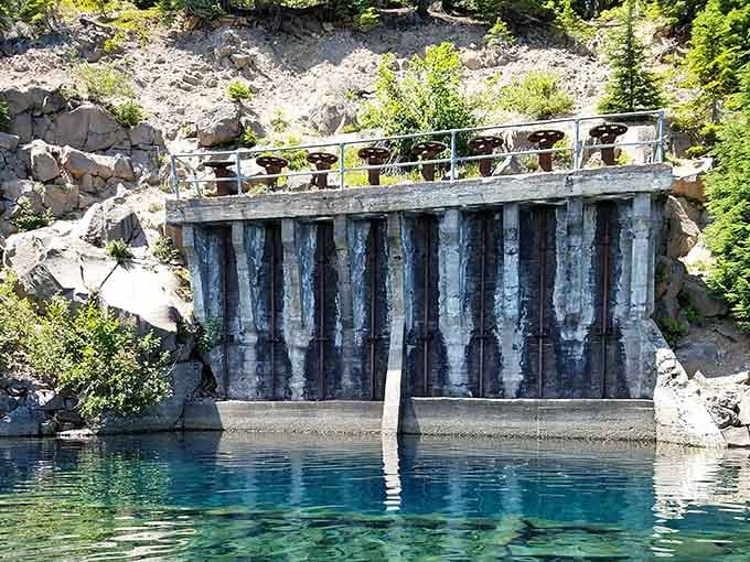 This historic headgate controls water flow, proving humans and nature can occasionally work together without making a mess.