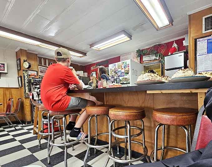 Counter seating where the best conversations happen and strangers become friends over shared meals and laughter.