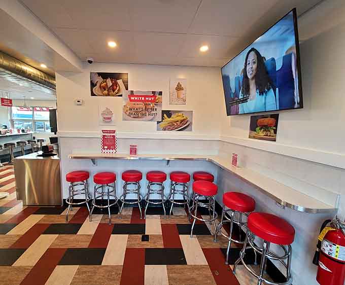 Classic diner seating with a view of the grill means dinner comes with entertainment included free.