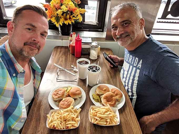 Happy customers enjoying the kind of meal that reminds you why simple pleasures are often the best ones.