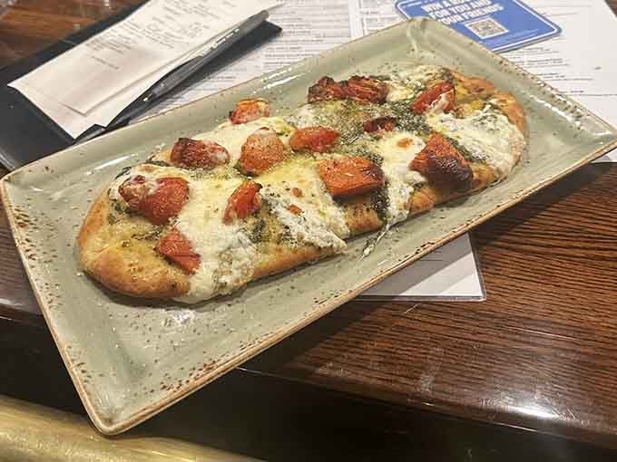 Flatbread topped with fresh ingredients offers a lighter option that doesn't sacrifice flavor for virtue or good intentions.