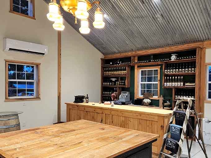 Warm lighting and shelves lined with bottles create a cozy tasting room that feels like your friend's really cool barn.