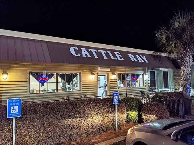 Cattle Bay glows invitingly after dark, beckoning hungry travelers with promises of hearty meals and Southern hospitality done right.