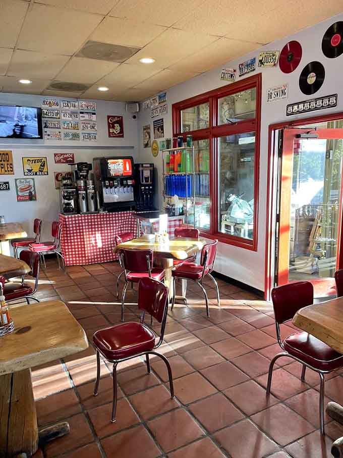 Red vinyl chairs and vintage signs create an atmosphere where Elvis could walk in and feel right at home.