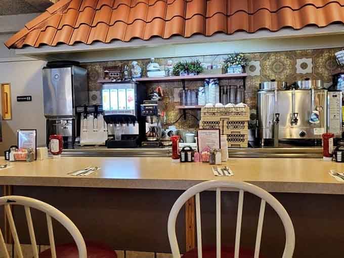 The classic diner counter with fresh coffee brewing is where morning magic happens every single day.