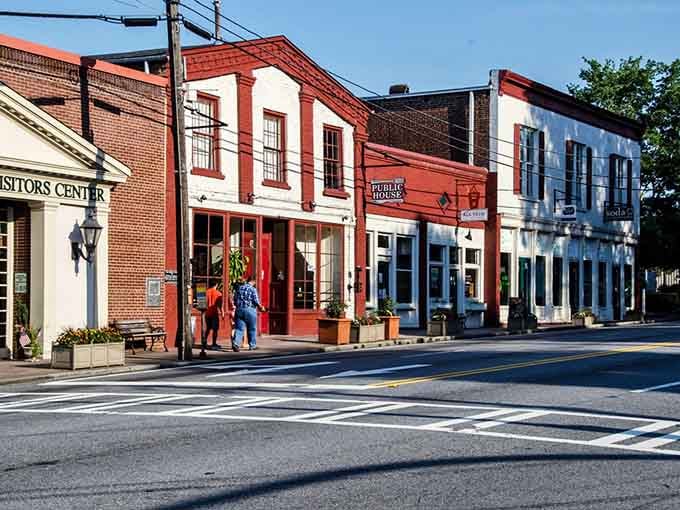 These preserved storefronts in warm brick tones create a Main Street that feels welcoming, not like a movie set.