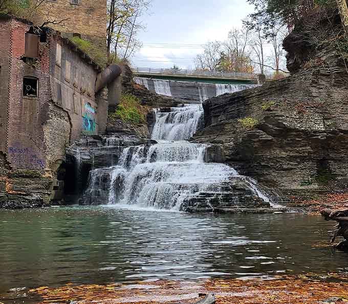 Old industrial ruins add mysterious character to this powerful waterfall hidden in a dramatic gorge.