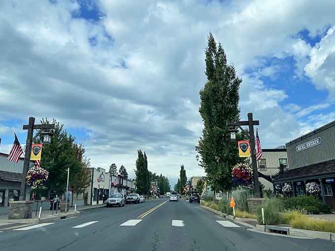 Colorful banners and flower baskets dress up the main drag where Western heritage meets contemporary outdoor recreation culture seamlessly.