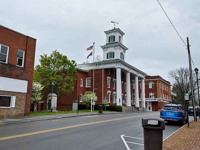 That white cupola rising above brick buildings and spring trees defines small-town elegance without trying too hard.