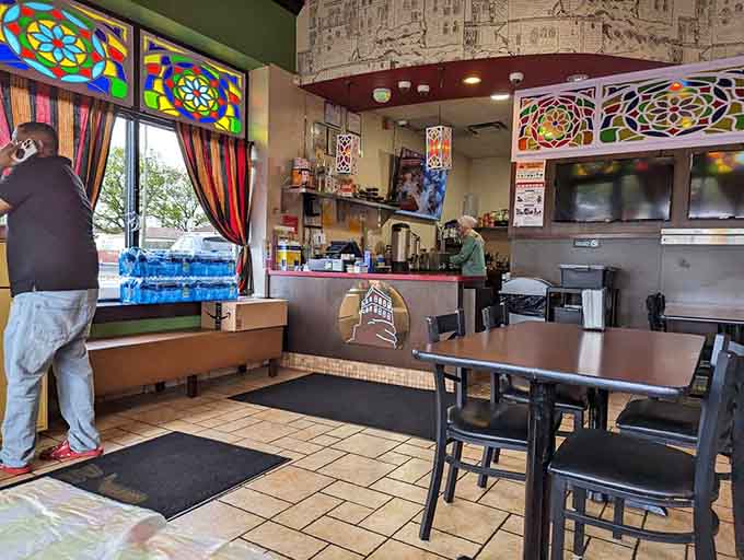 The counter area showcases those gorgeous stained glass windows while keeping operations running smoothly behind the scenes.