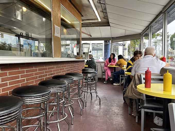 Real people enjoying real burgers in a real diner, no filters or pretension required here.