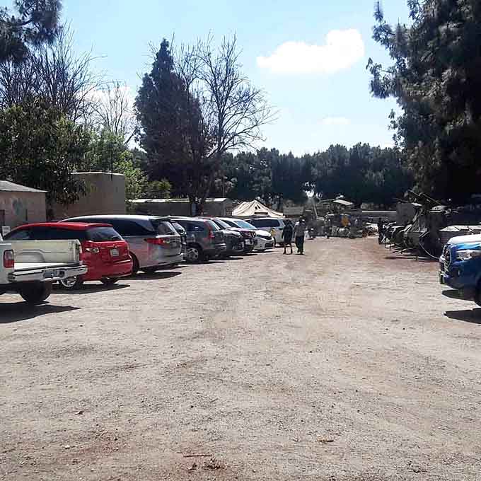 Regular folks park their Toyotas next to military history, creating the most wonderfully unexpected California juxtaposition.