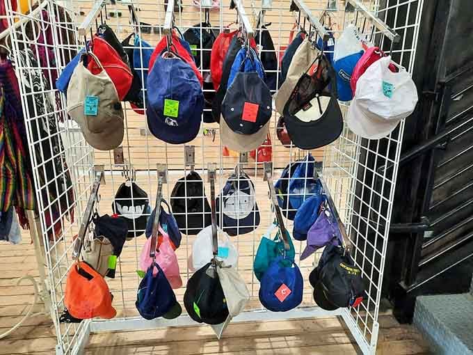 Baseball caps organized by color, because protecting your head from sun shouldn't cost more than lunch out.