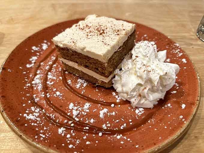 Layers of chocolate cake and cream dusted with cocoa, because the Black Forest knows how to end a meal.