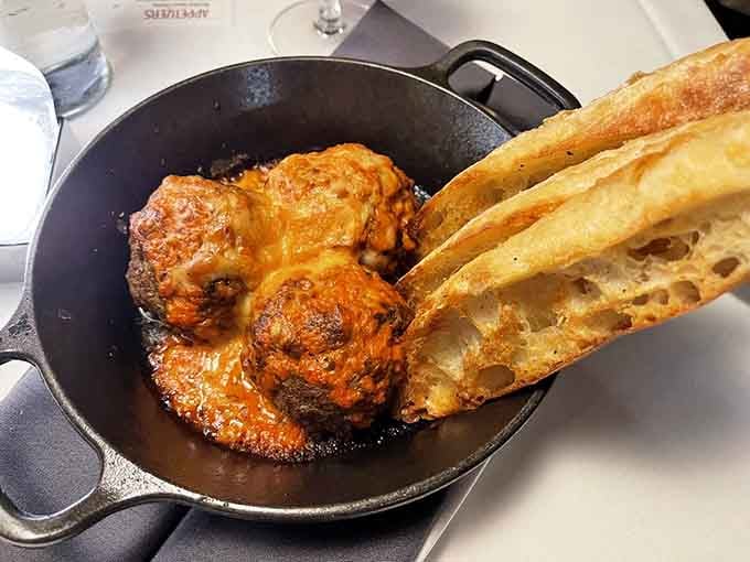 Wagyu meatballs served in a skillet that's practically begging you to grab that crusty bread.