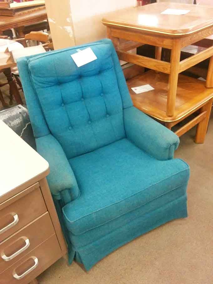 This teal tufted armchair adds a pop of color that interior designers charge thousands to achieve in magazines.