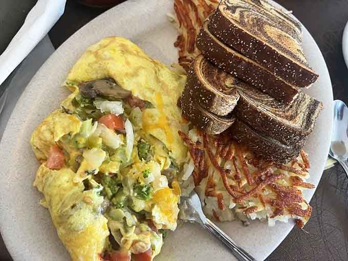 A veggie omelet so colorful and generous, it makes eating your vegetables feel like winning the breakfast lottery.