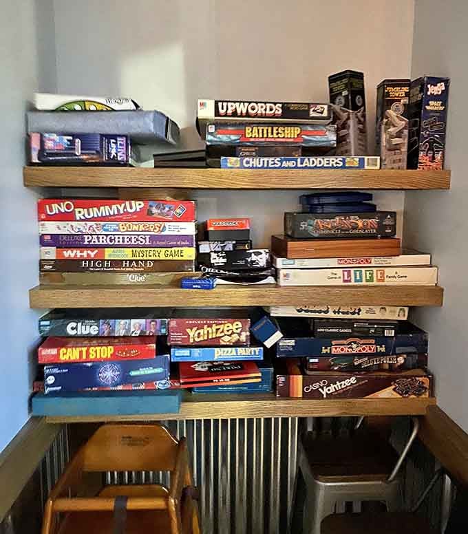 Classic board games line the shelves, offering yet another layer of nostalgic entertainment for every visitor.