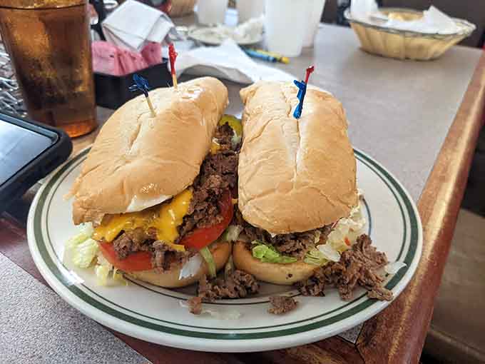 Cheesesteak sub loaded with meat and cheese, because sometimes you need both hands and zero regrets for lunch.